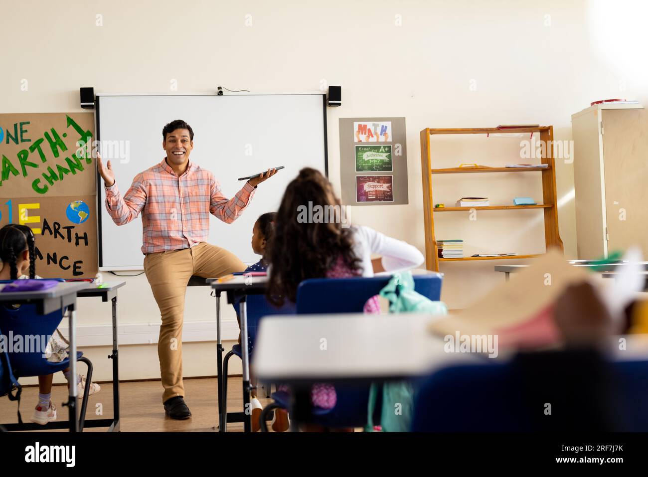 Happy male teacher hi-res stock photography and images - Alamy
