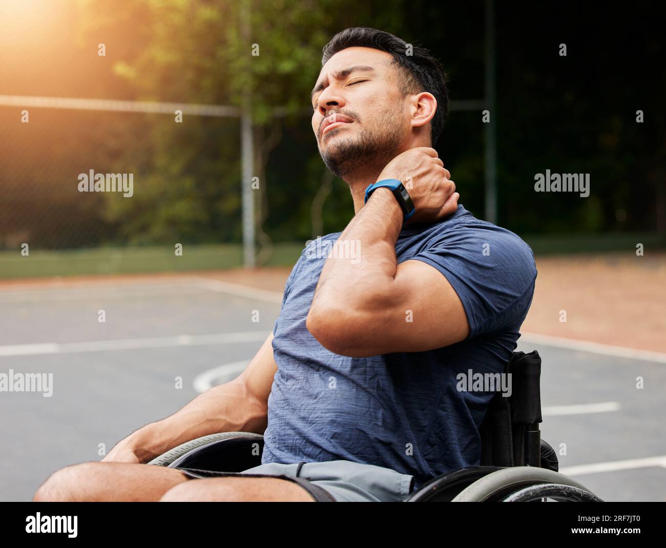 Neck pain, fitness and basketball court with man and wheelchair user ...