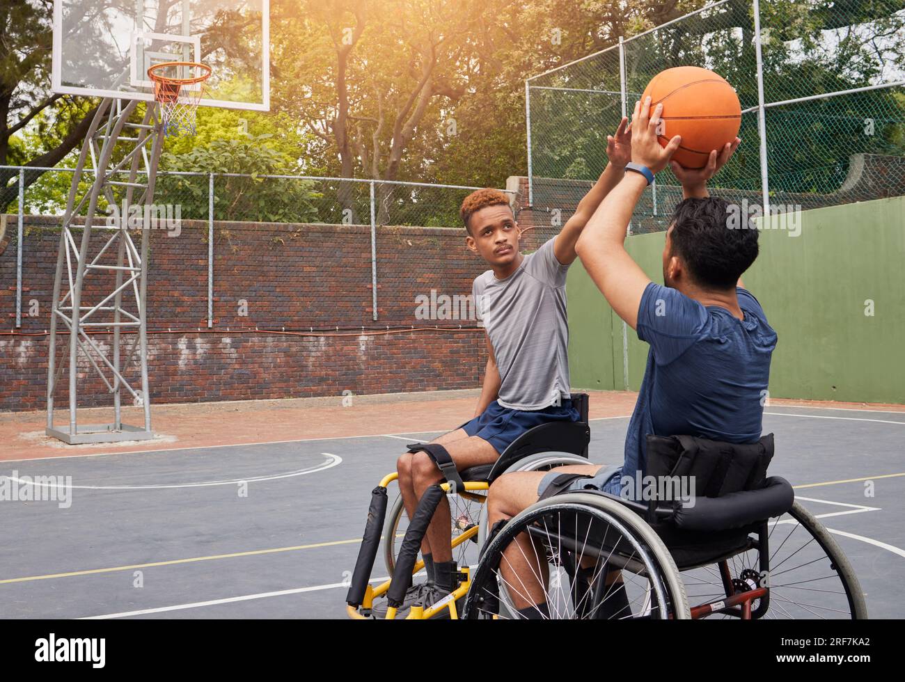 Sports, wheelchair basketball and people shooting ball in match ...