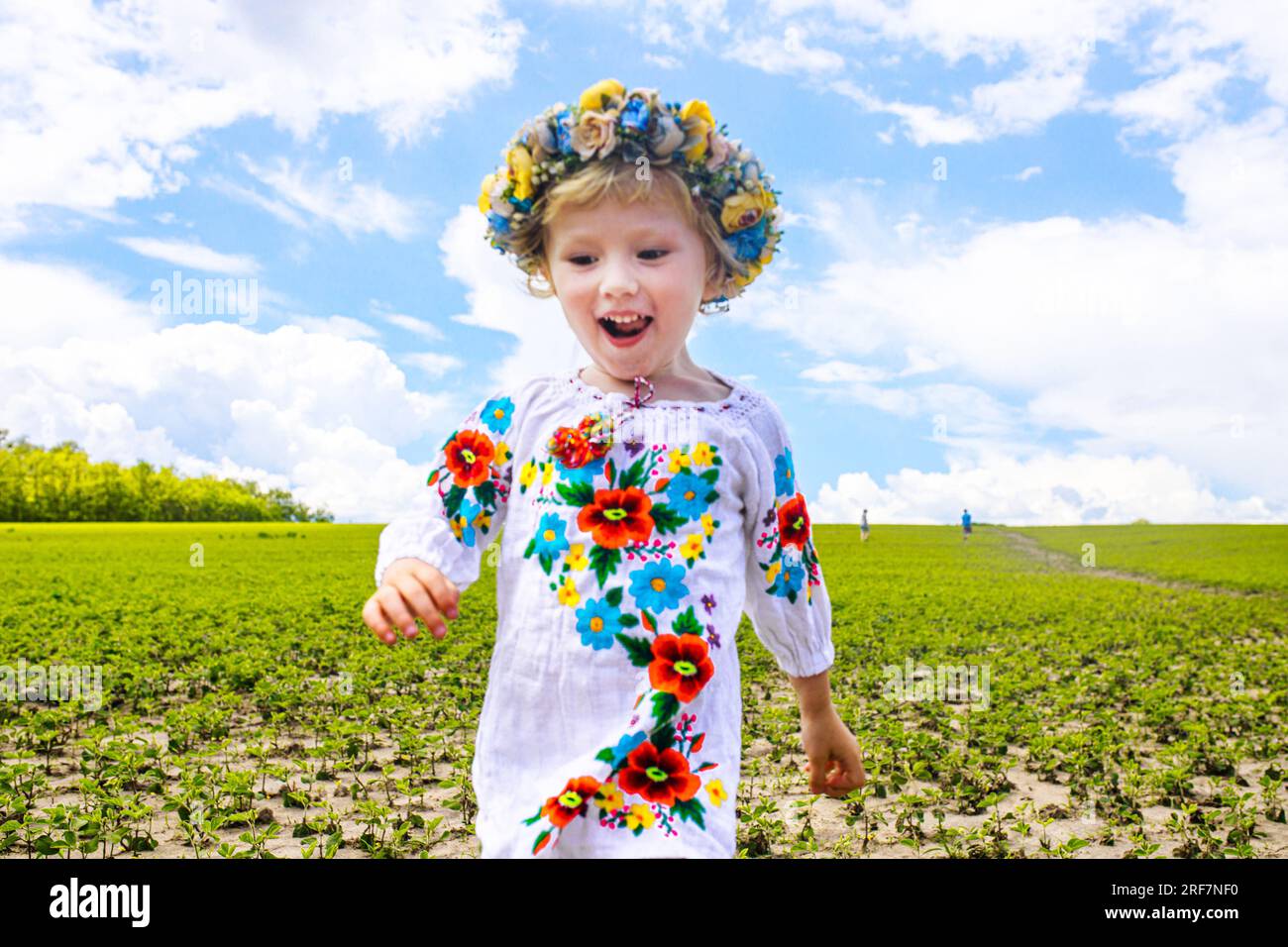 Happy Ukrainian child in free Ukraine without war runs along a rural ...