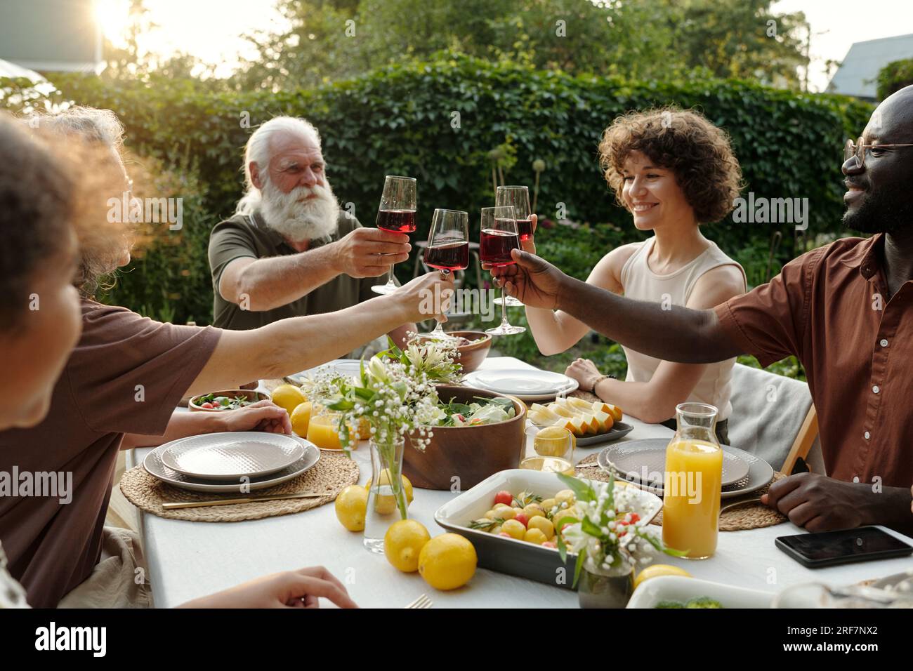 Happy large family celebrating toasting hi-res stock photography and ...