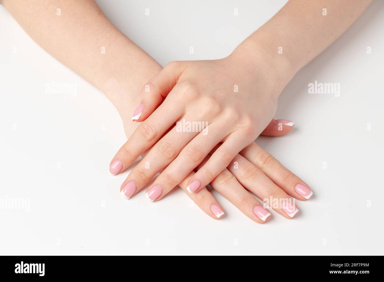 Well-groomed female hands with manicure on white background Stock Photo ...