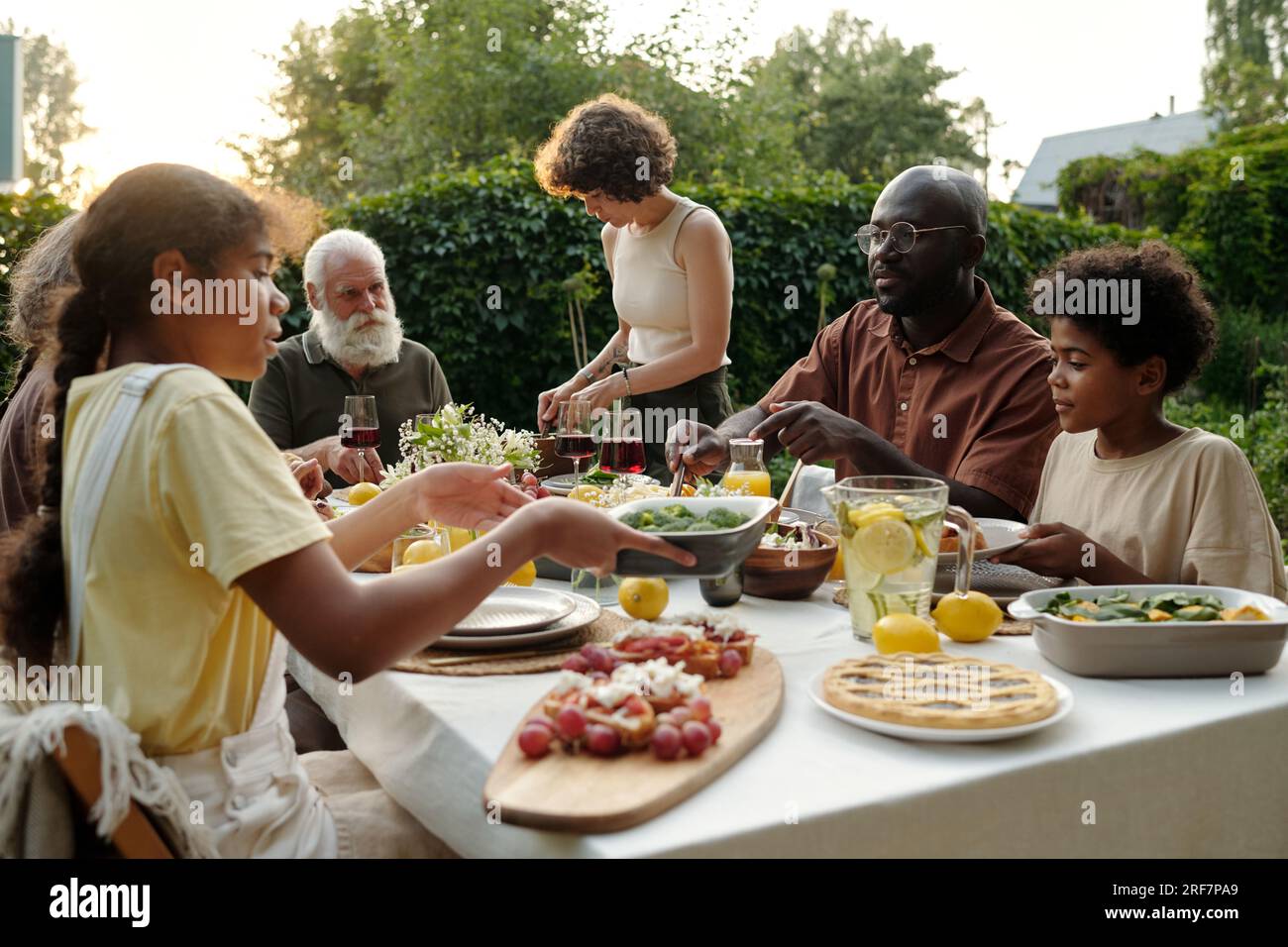 Modern family of siblings, their intercultural parents and grandparents ...