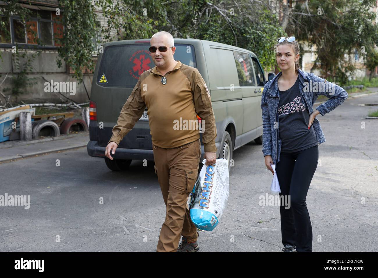 KYIV, UKRAINE - JULY 29, 2023 - Kyiv-based volunteer Tim Zlatkin carries a pack of cat food ...
