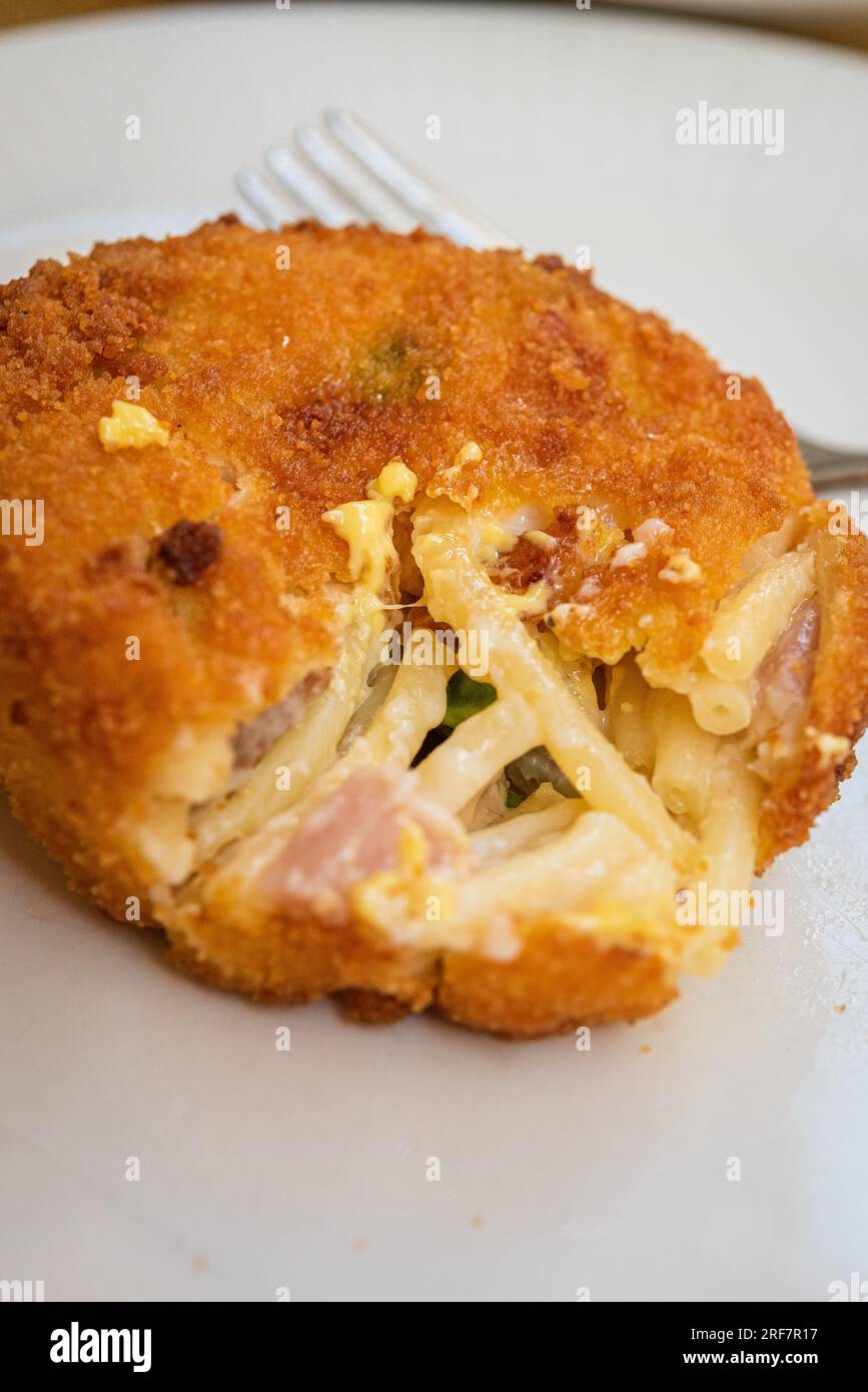 Fried pasta appetizer on a white plate in an Italian restaurant Stock ...