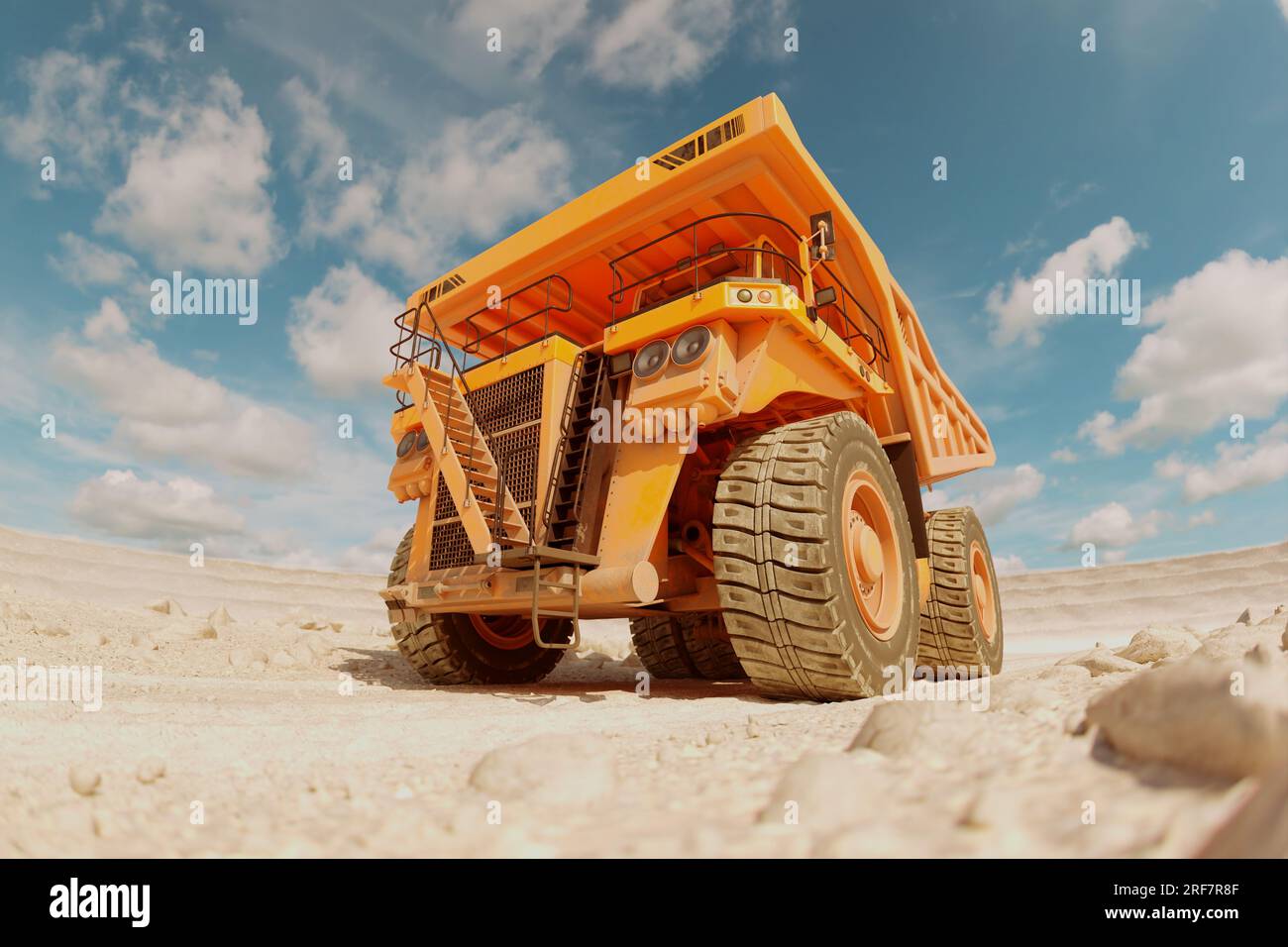 A giant, yellow dump truck transporting a heavy load through a dusty ...