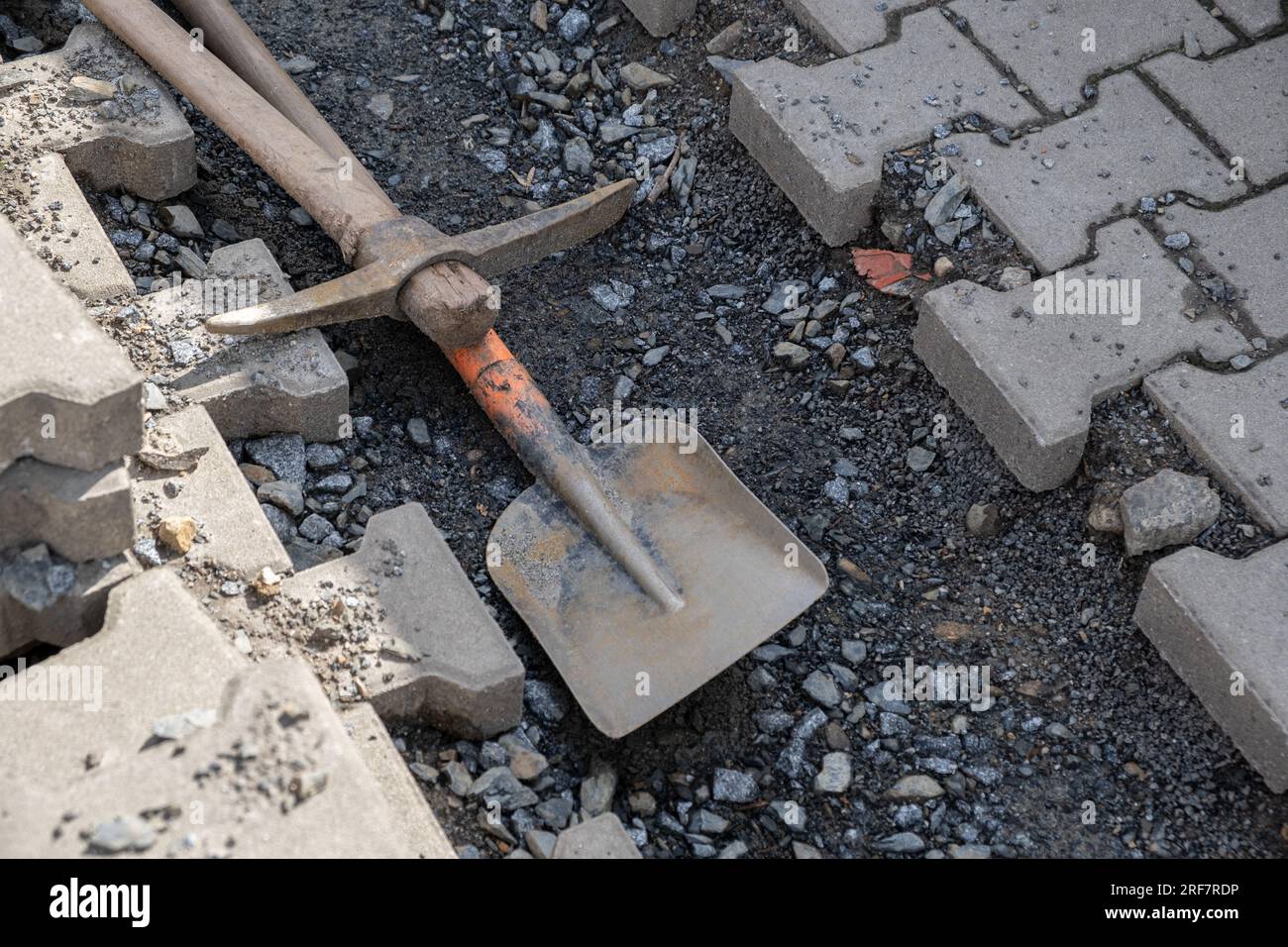 pick and shovel at construction site. Digging work on communication ...