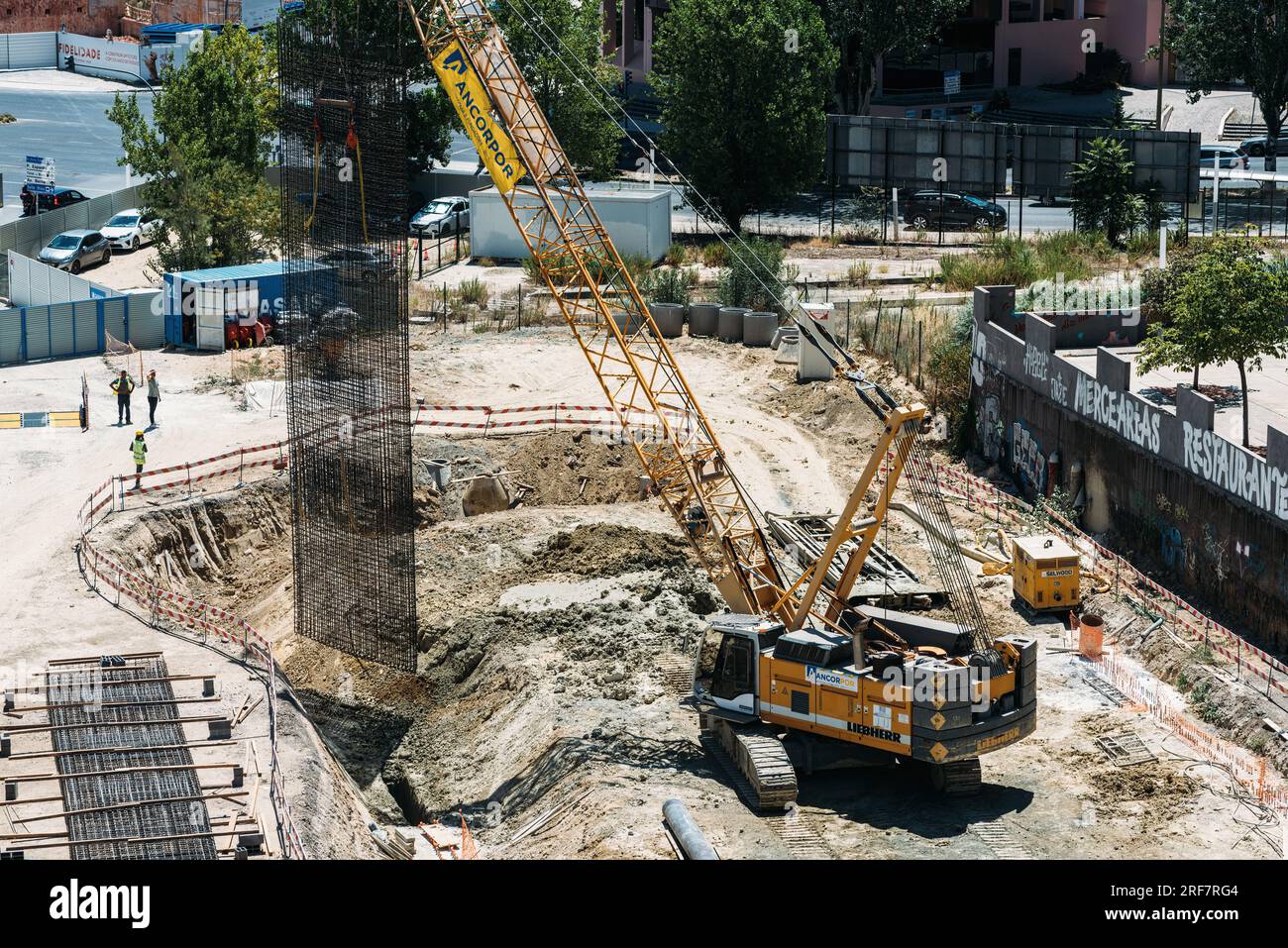 High perspective view of a busy construction area, including laying ...