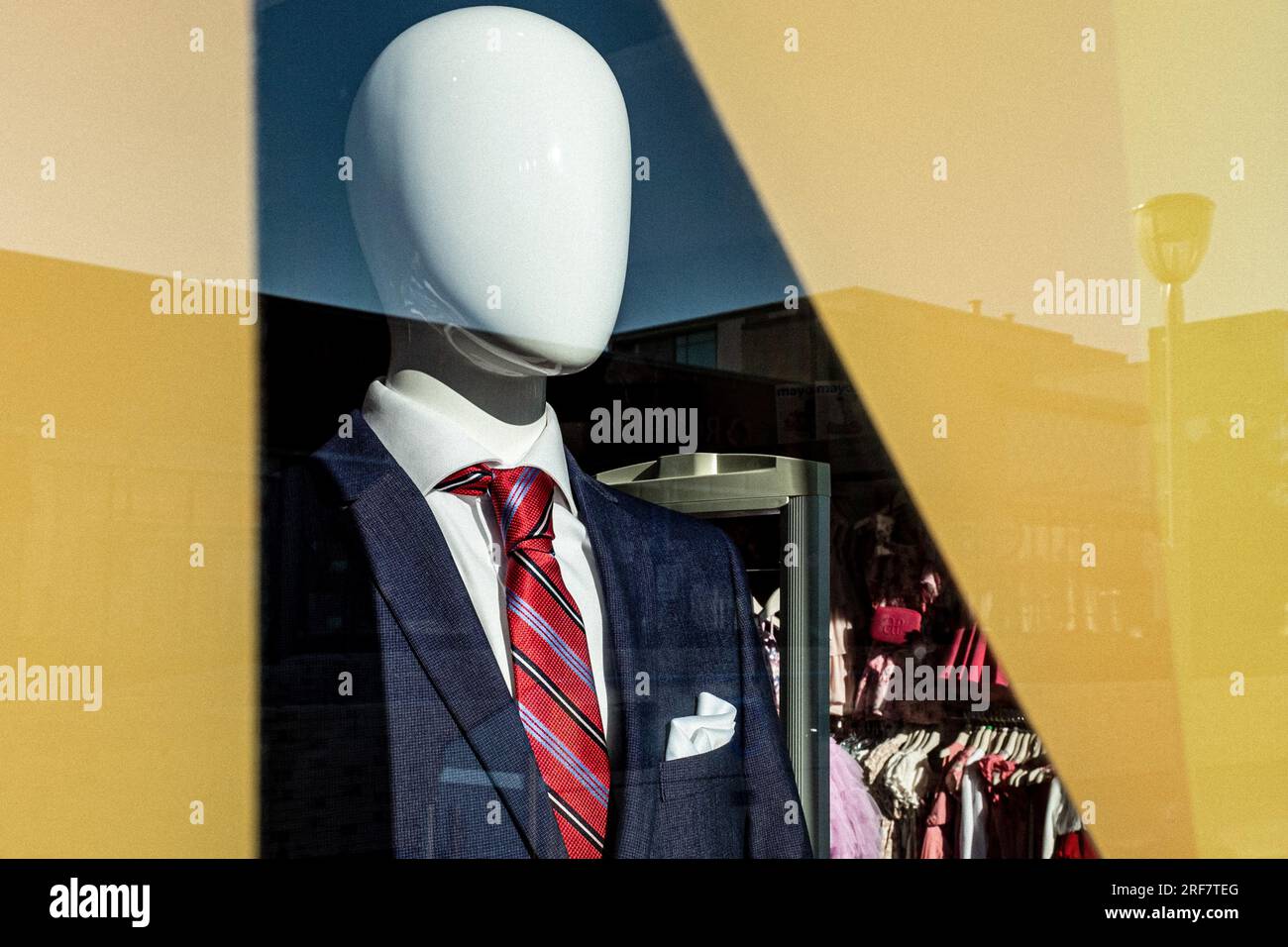 Mannequin in store front window Stock Photo - Alamy