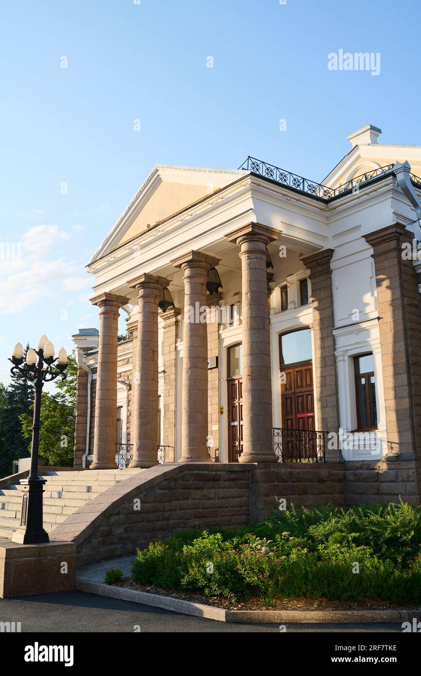 Facade of architectural monument of classic style with columns, street ...