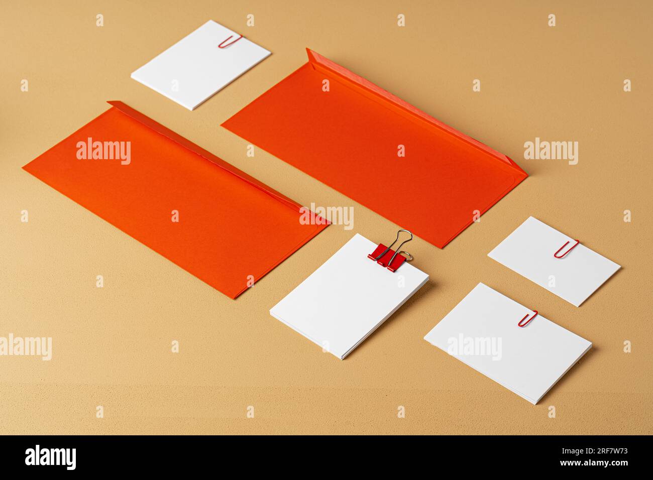 Red and white blank branding paper on beige background Stock Photo - Alamy
