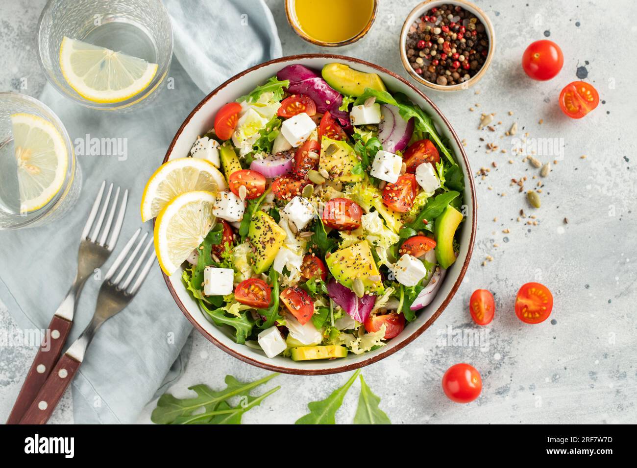 Delicious and healthy green salad of different leaves and vegetables ...