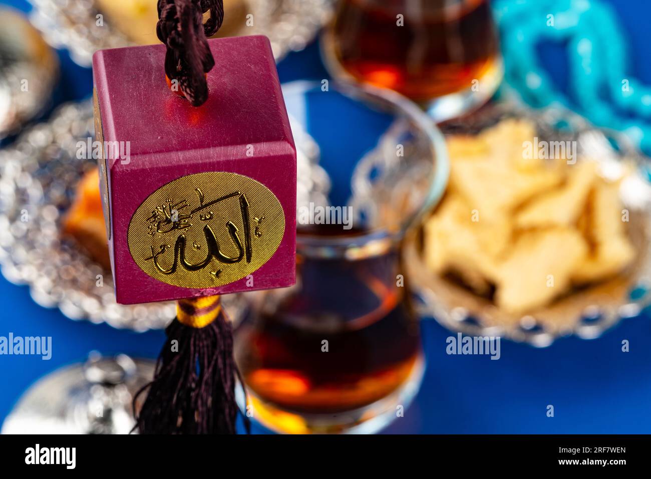 Muslim amulet of bordeux color on rope Stock Photo - Alamy