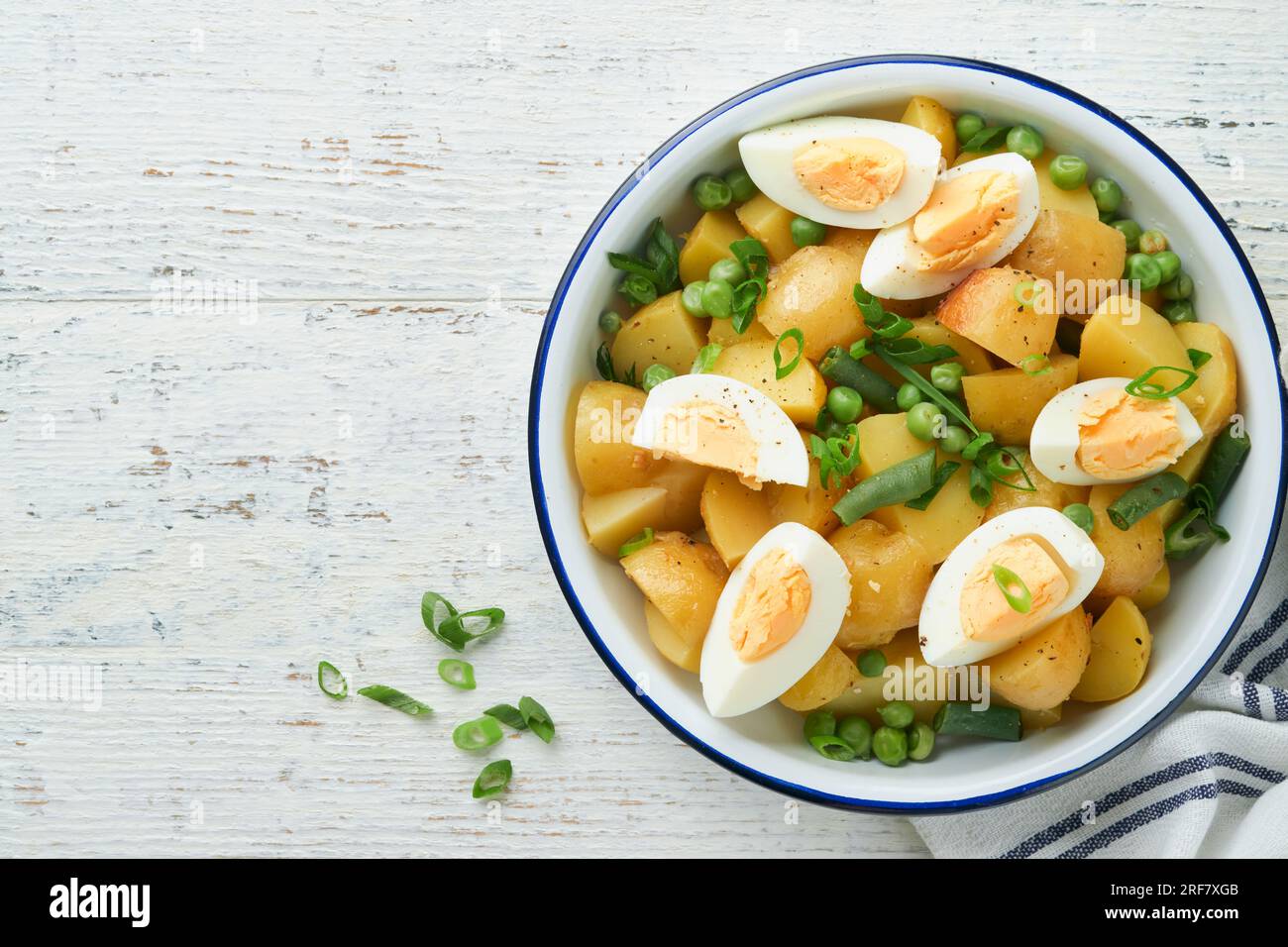 Traditional Potato salad with bacon and eggs in a white bowl. Picnic ...