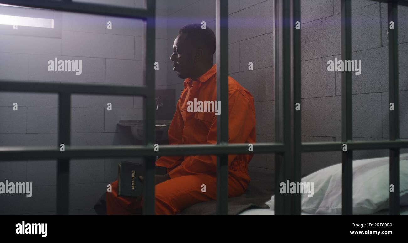 Man sits in jail cell hi-res stock photography and images - Alamy