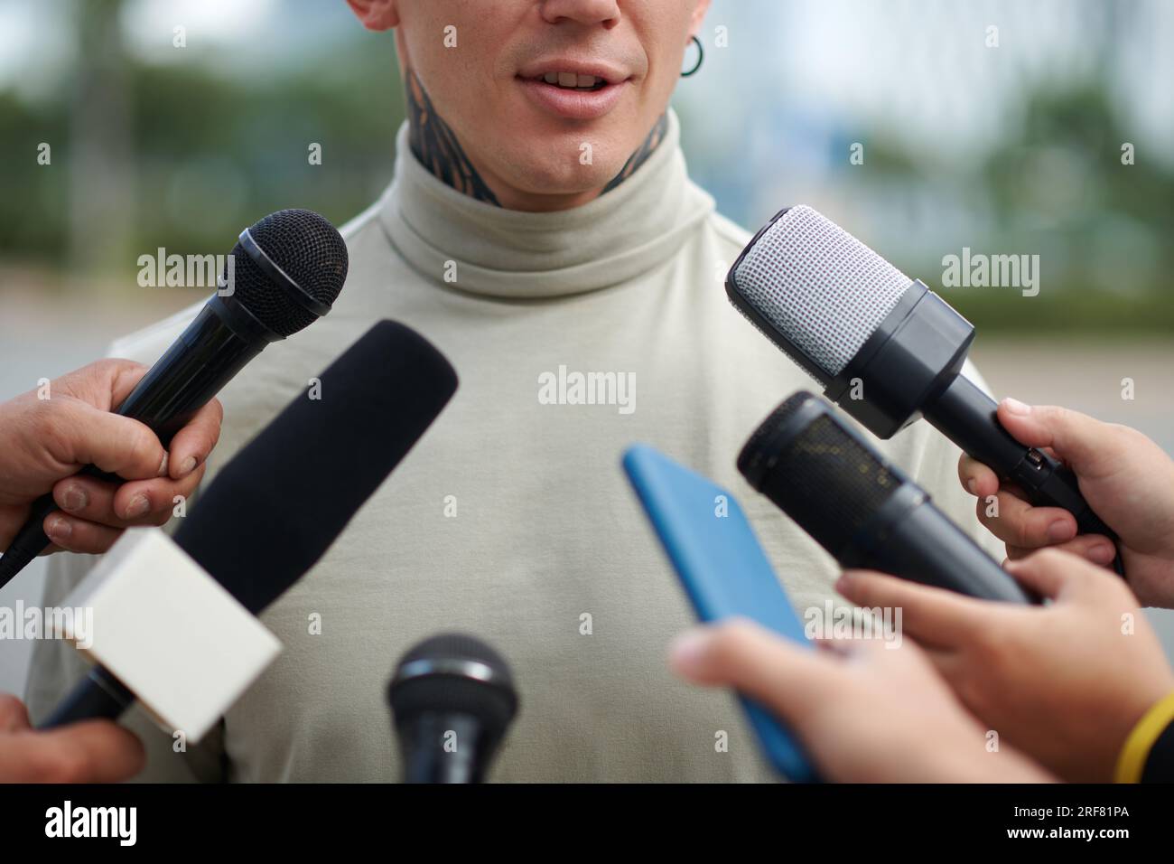 Famous person answering questions of many journalists Stock Photo - Alamy