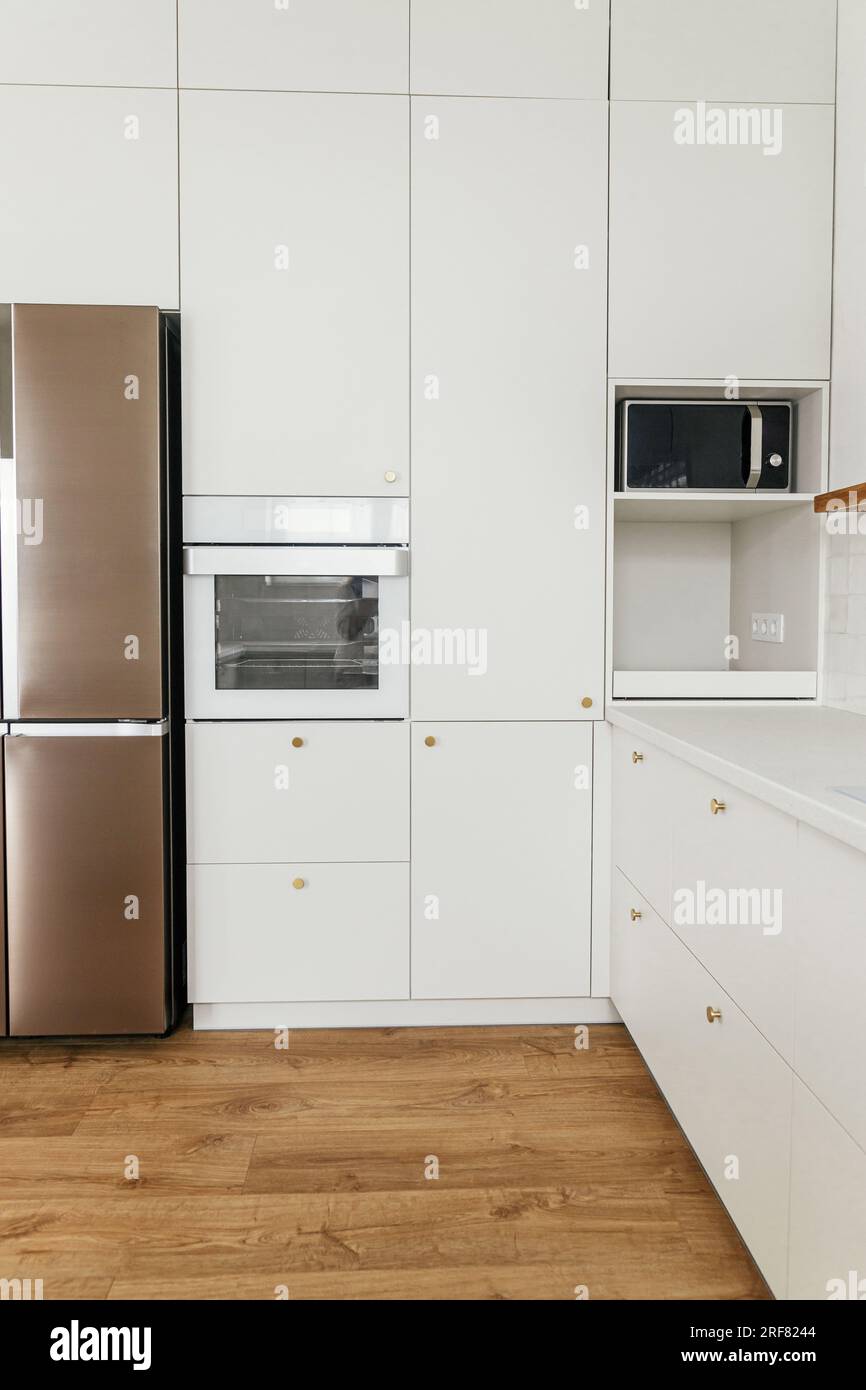 Modern minimal kitchen design. Stylish white kitchen cabinets with ...