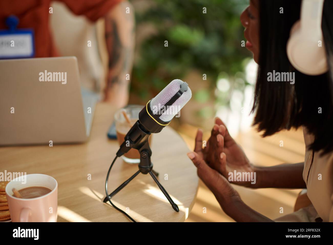 Young Black woman expressing her opinion when talking to podcaster ...