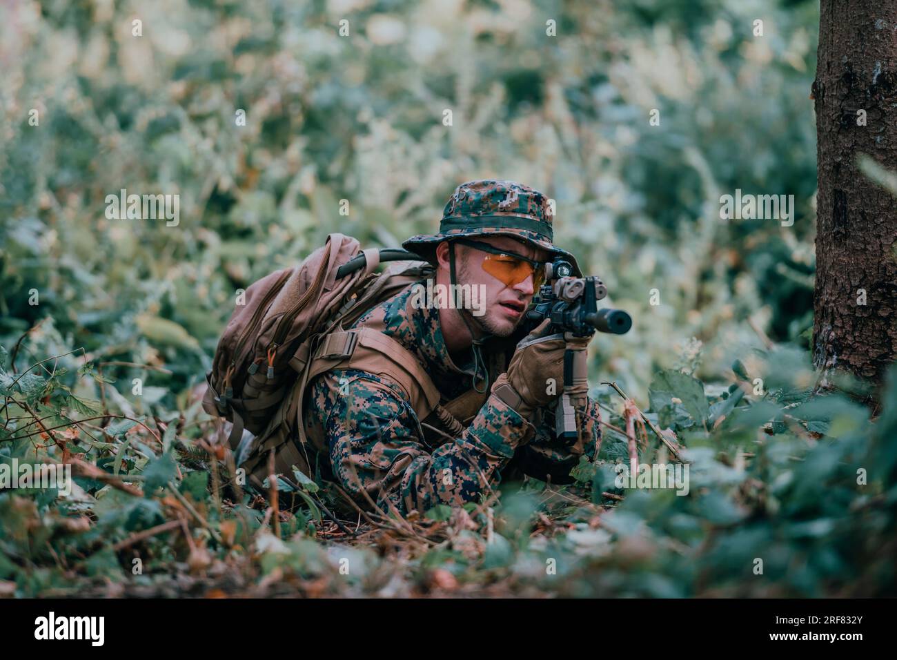 Modern warfare soldier surrounded by fire, fight in dense and dangerous ...
