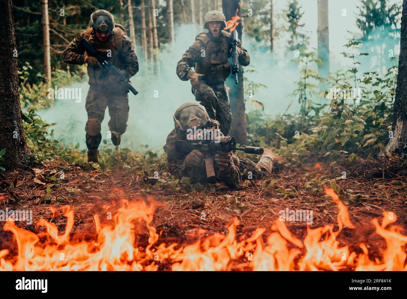 Modern warfare soldiers surrounded by fire fight in dense and dangerous ...
