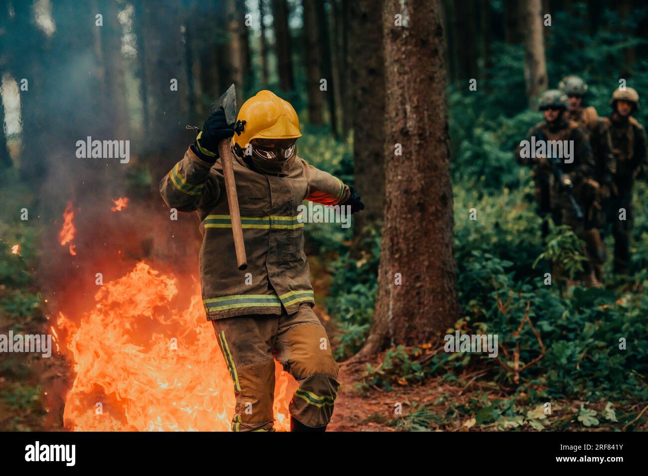 firefighter hero in action danger jumping over fire flame to rescue and ...