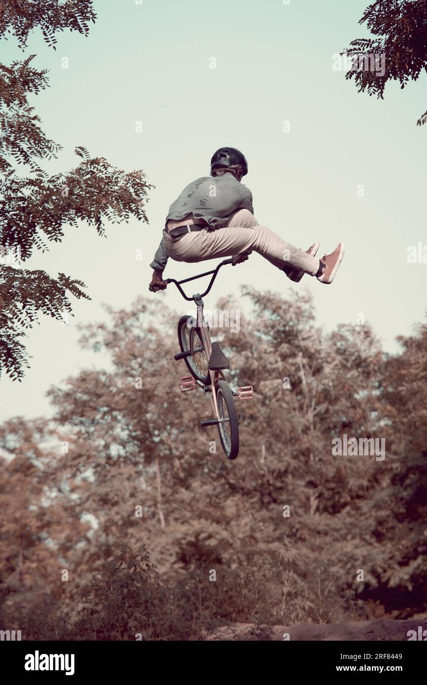 Boy riding his bmx in forest hi-res stock photography and images - Alamy