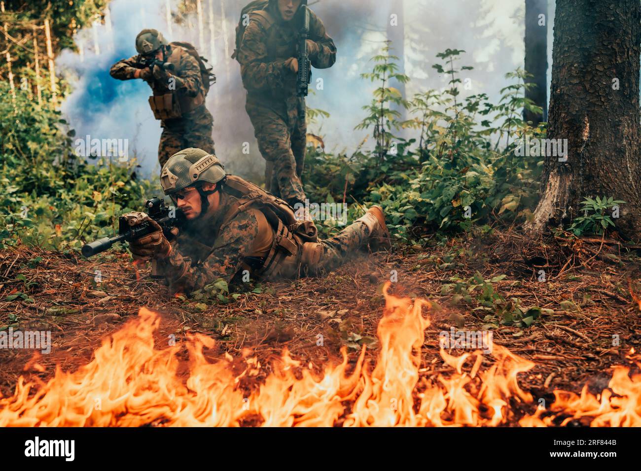 Modern warfare soldiers surrounded by fire fight in dense and dangerous ...
