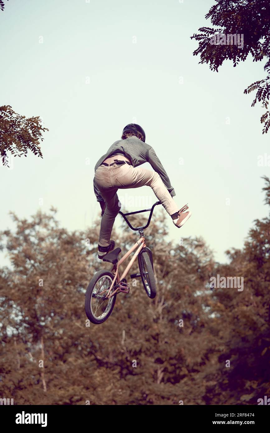 Boy riding his bmx in forest hi-res stock photography and images - Alamy