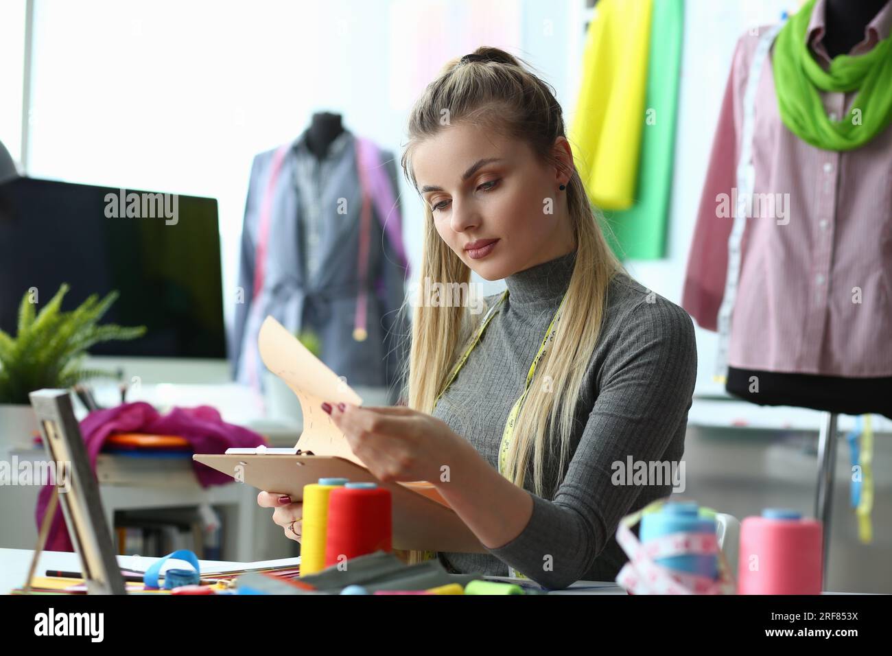 Fashion designer is working on a color design in studio Stock Photo - Alamy