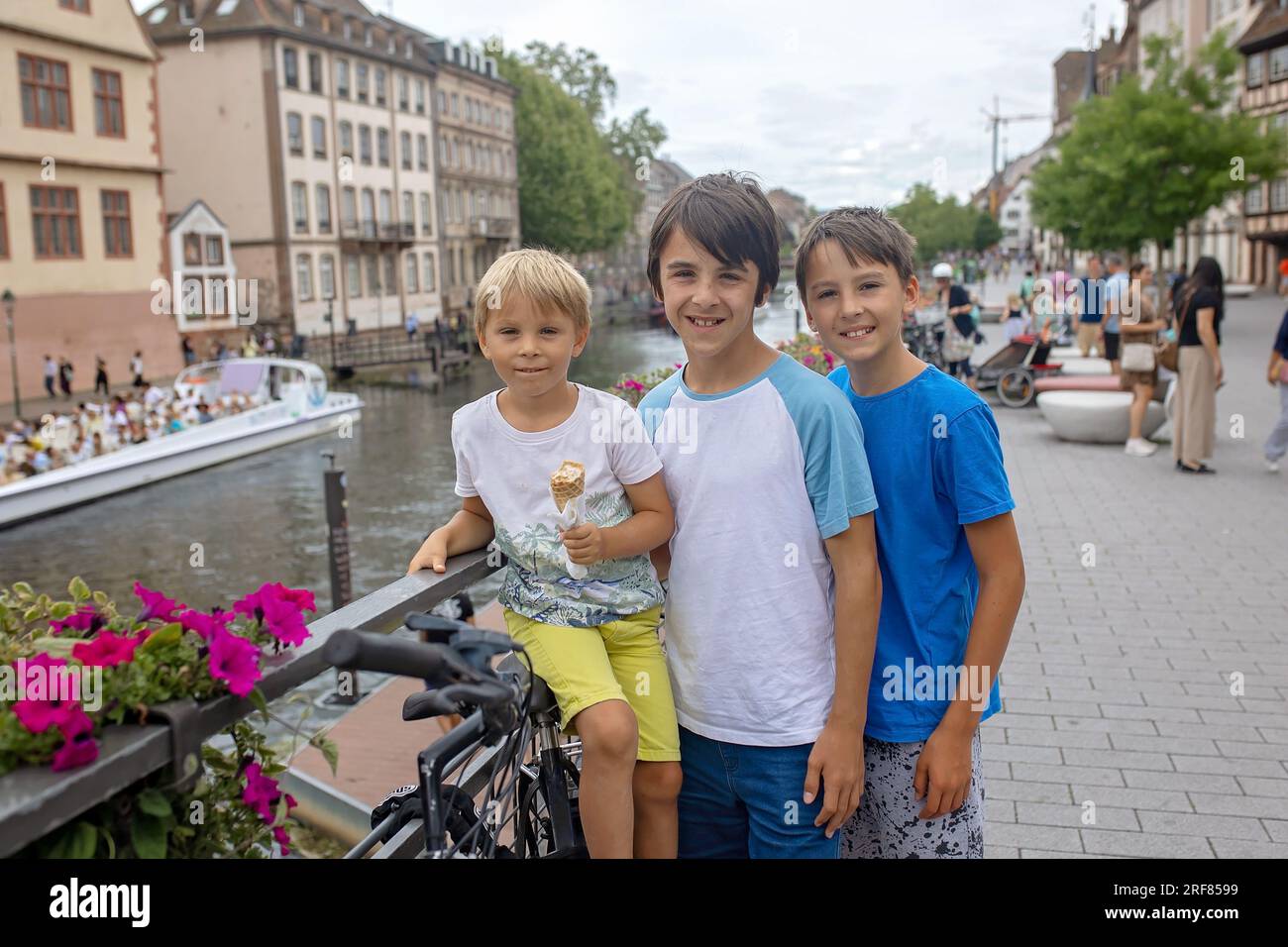 Beautiful family with children, boys, visiting Strasbourg in France ...