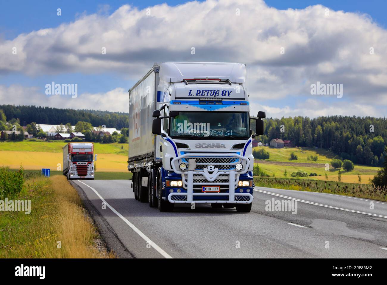Customised Scania truck L Retva Oy pulls semi-trailer on road 110 on a ...