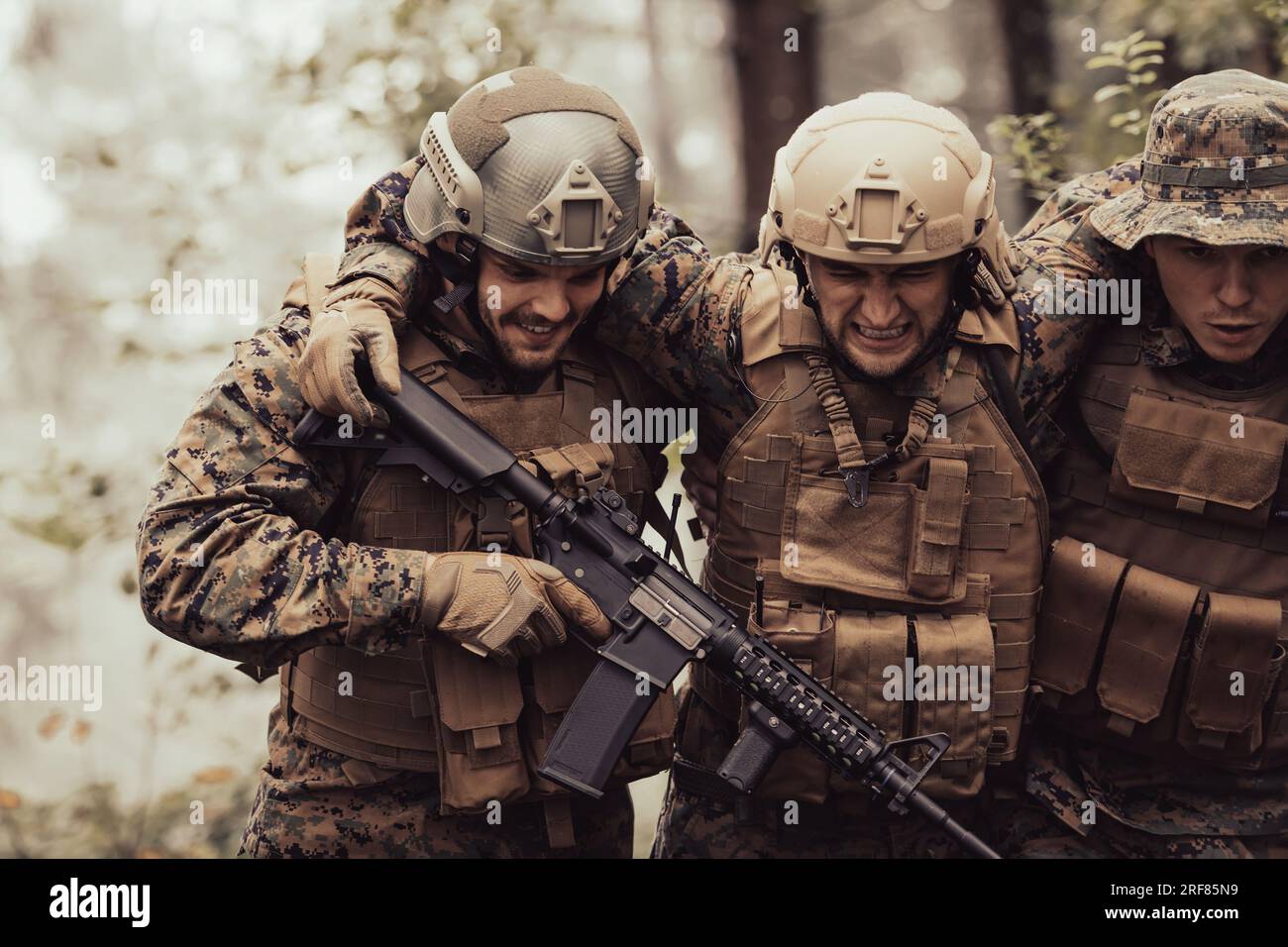 Modern warfare military squad in battle action rescue wounded soldier ...