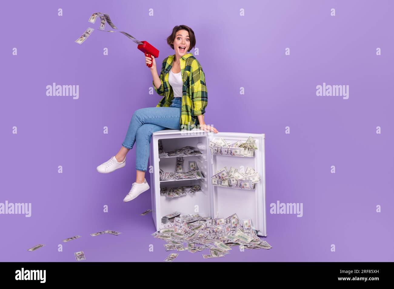 Full body photo of young crazy girl rejoice shoot gun pistol winner ...