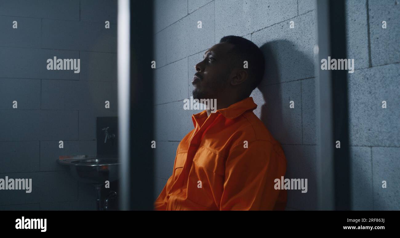 Man sits in jail cell hi-res stock photography and images - Alamy
