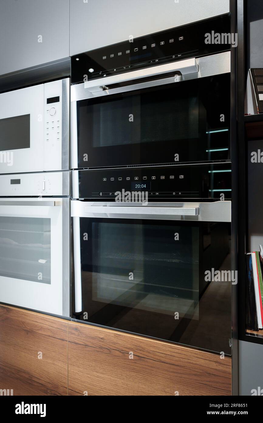 New ovens in household appliance section in store Stock Photo - Alamy
