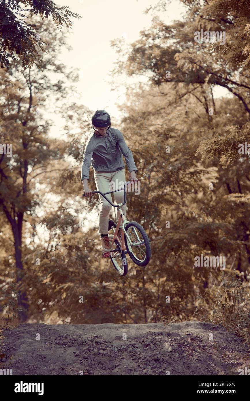 Boy riding his bmx in forest hi-res stock photography and images - Alamy
