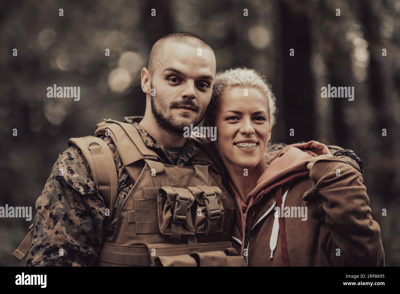 Happy woman in love hugging hero soldier Stock Photo - Alamy