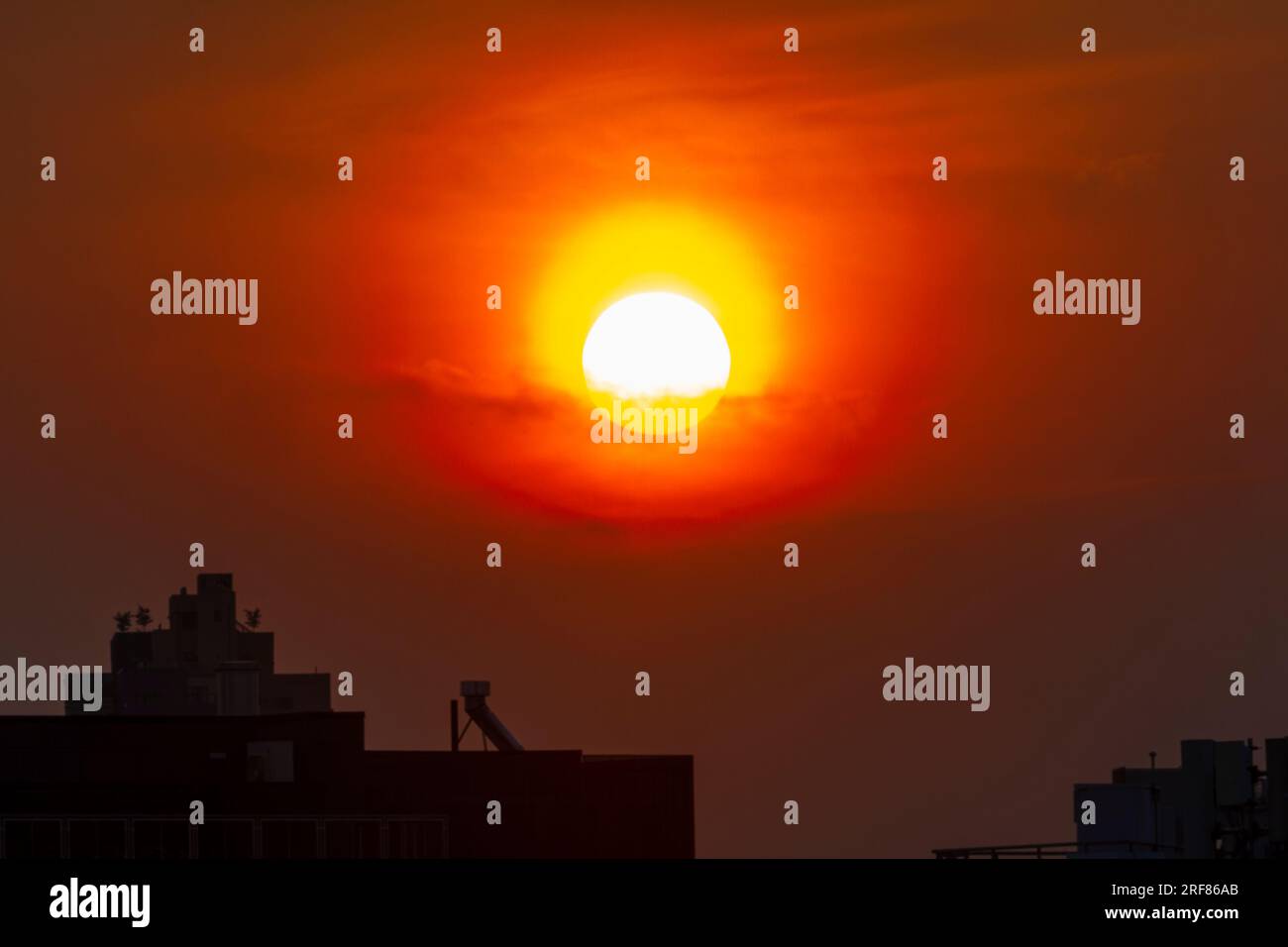 View of the sunset in New York City from a window in Williamsburg ...