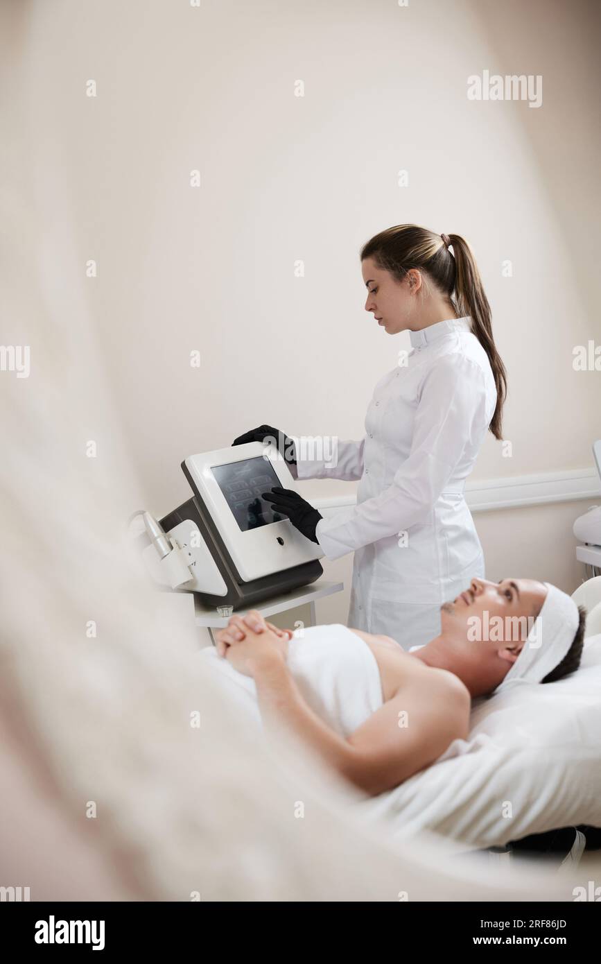 handsome man on RF lifting procedure in medicine clinic Stock Photo - Alamy