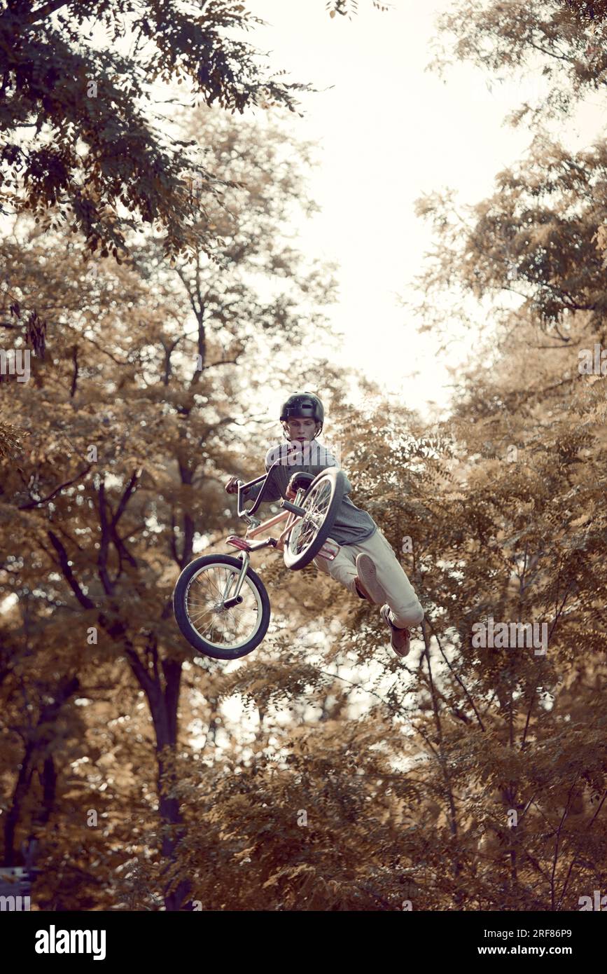 Boy riding his bmx in forest hi-res stock photography and images - Alamy