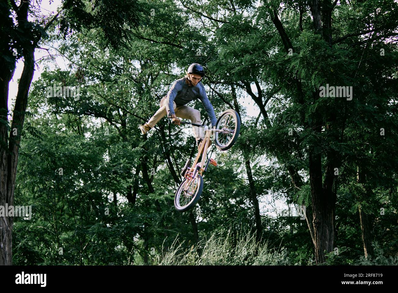 Boy riding his bmx in forest hi-res stock photography and images - Alamy