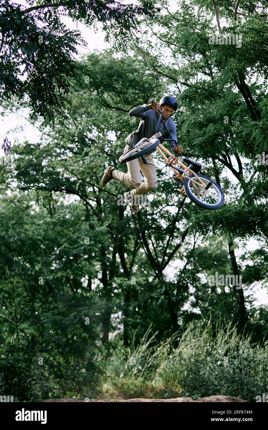 Boy riding his bmx in forest hi-res stock photography and images - Alamy