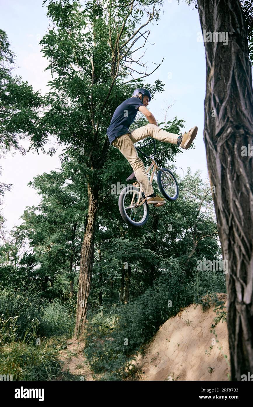Boy riding his bmx in forest hi-res stock photography and images - Alamy