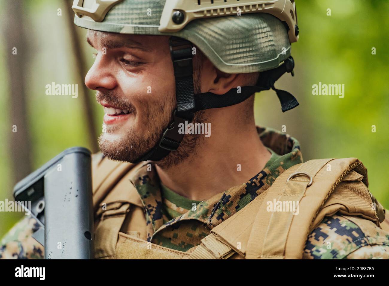 A modern warfare soldier on war duty in dense and dangerous forest ...