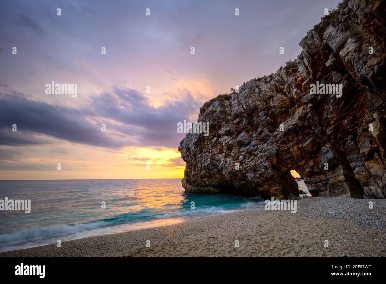 Seascape at sunrise. The sun rises over the sea and illuminates it ...