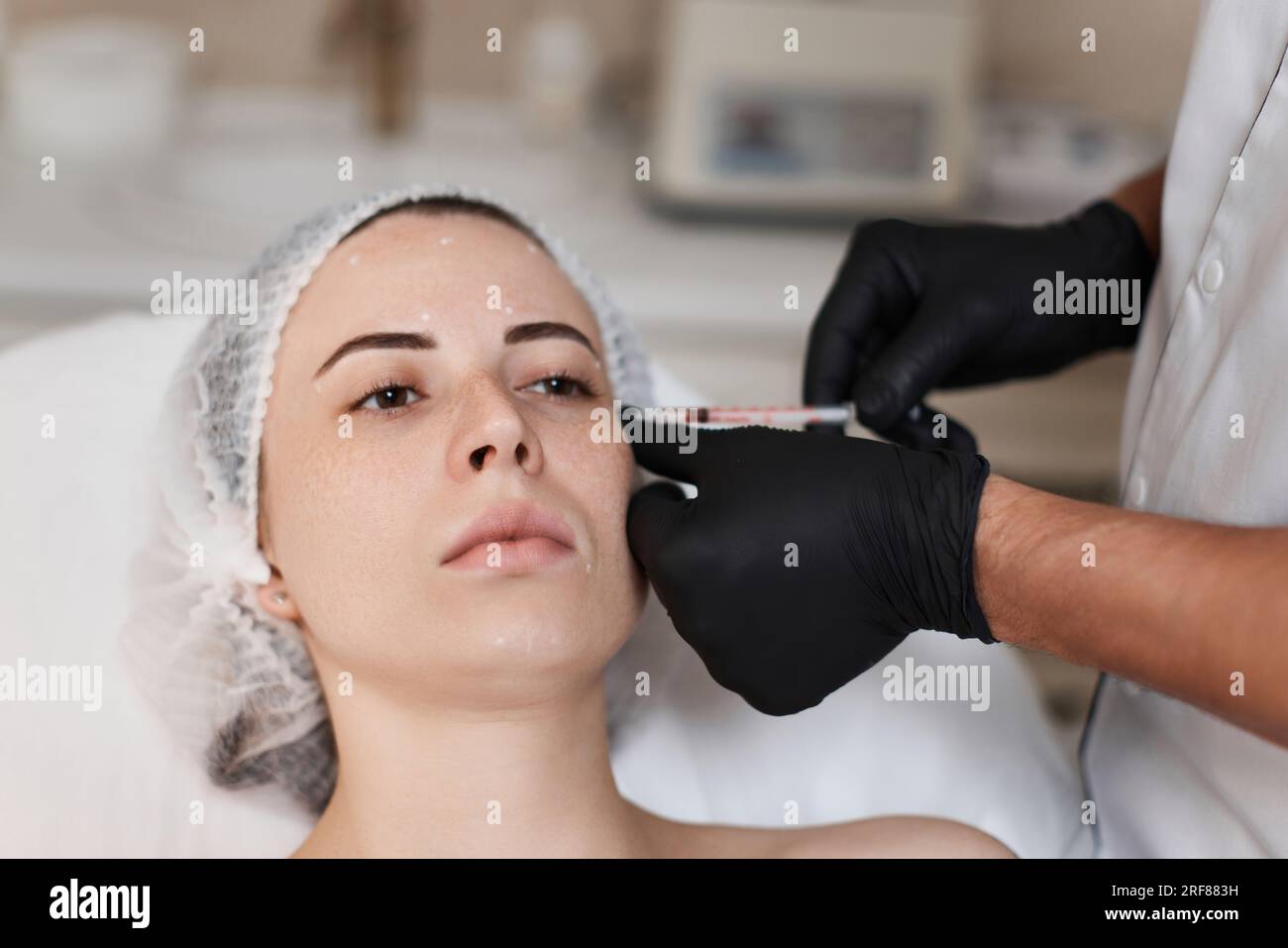 woman receives cosmetic botox injection in face Stock Photo - Alamy