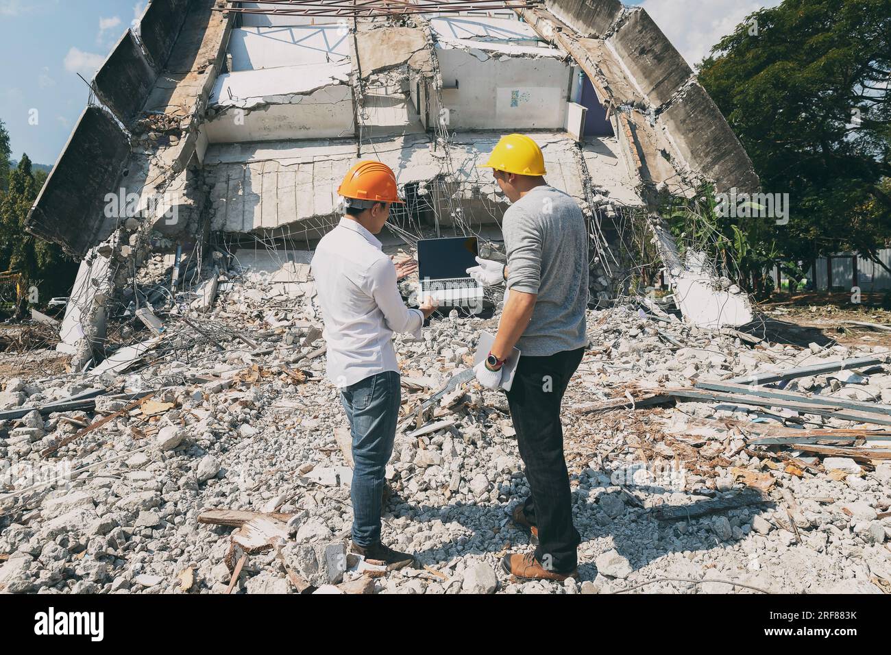 Demolition control supervisor and contractor discussing on demolish ...