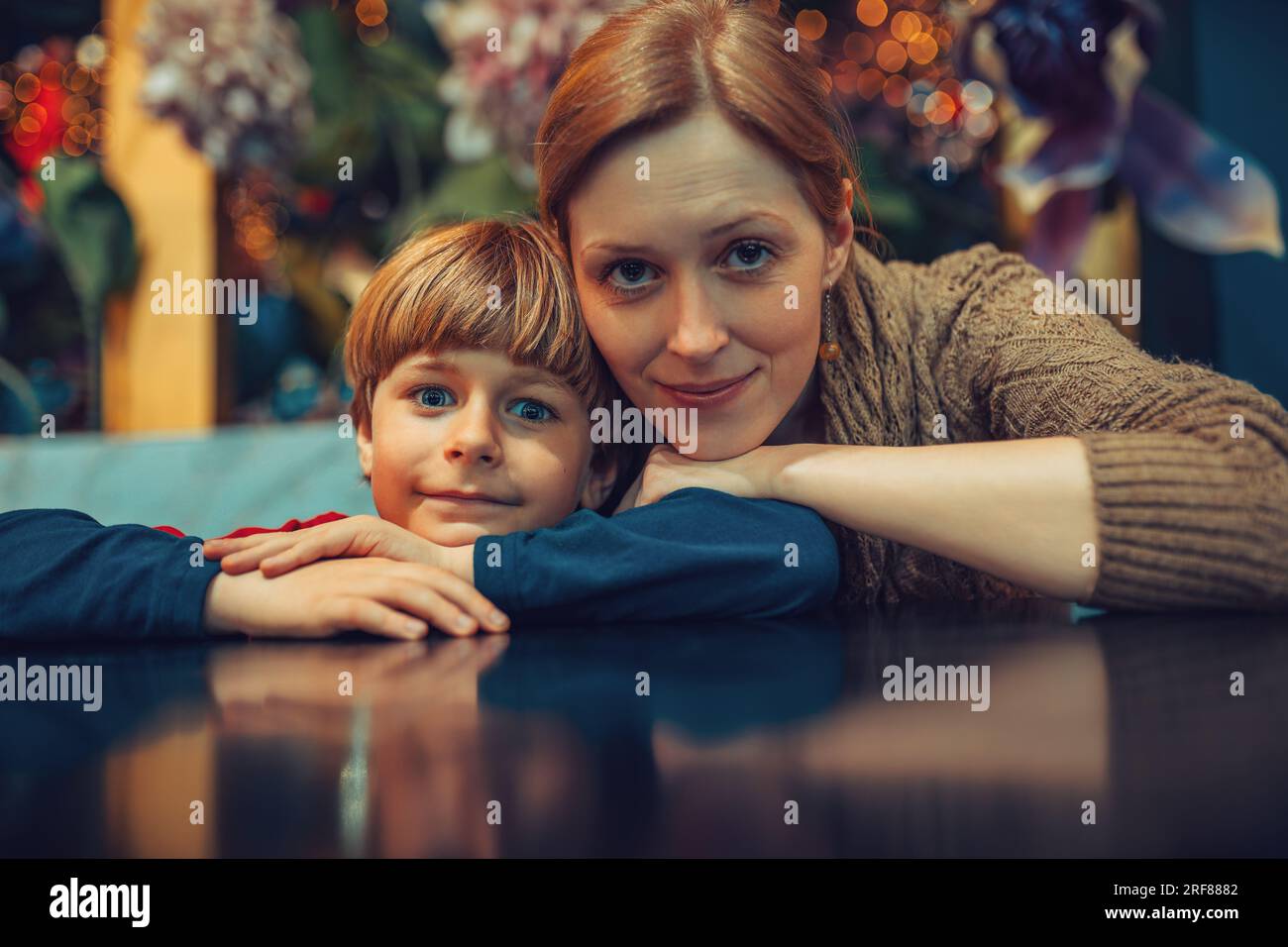 Mother and child sitting in caffe portrait Stock Photo - Alamy