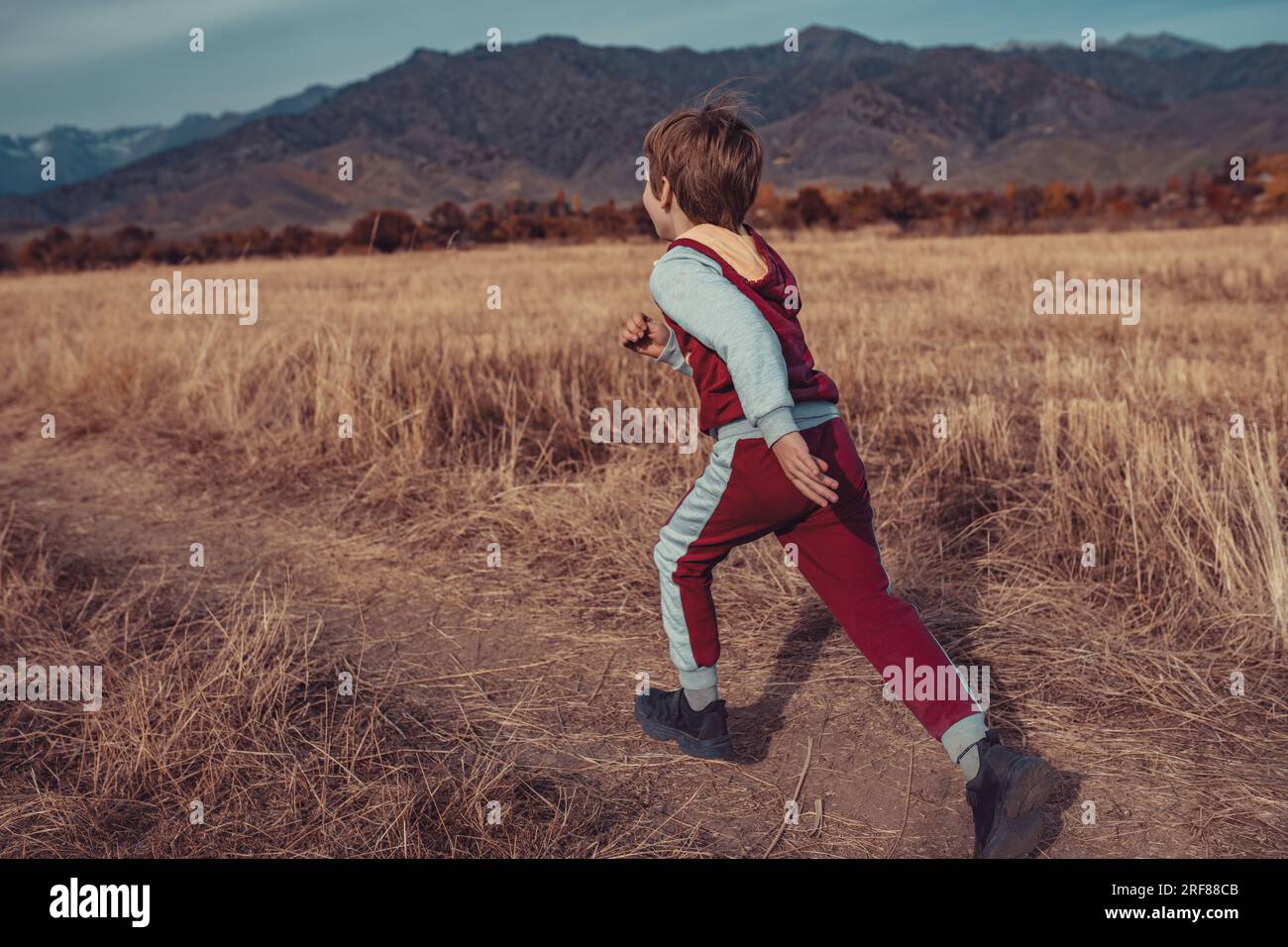 Child red running hi-res stock photography and images - Alamy