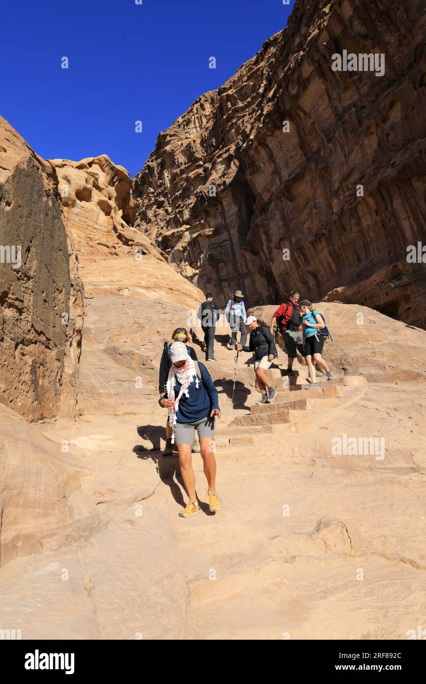 People on the Ad Deir Monastery trail down to Petra city, UNESCO World ...
